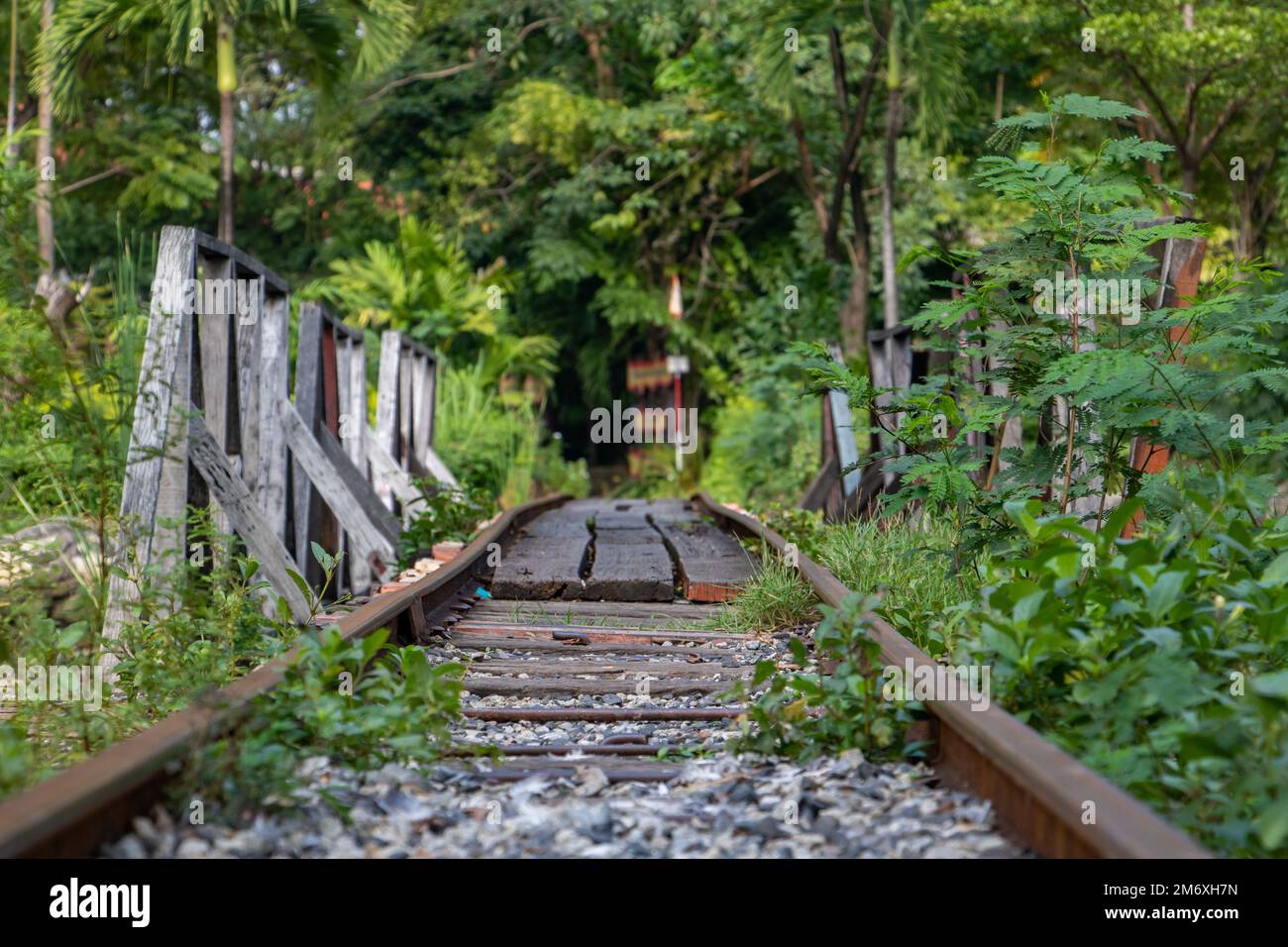 Old railway track with railing on the bridge Stock Photo - Alamy