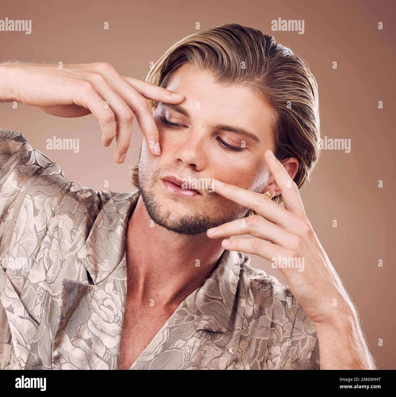 Beauty, man and hands frame face, cosmetics and non binary with skincare, manicure and glow ...