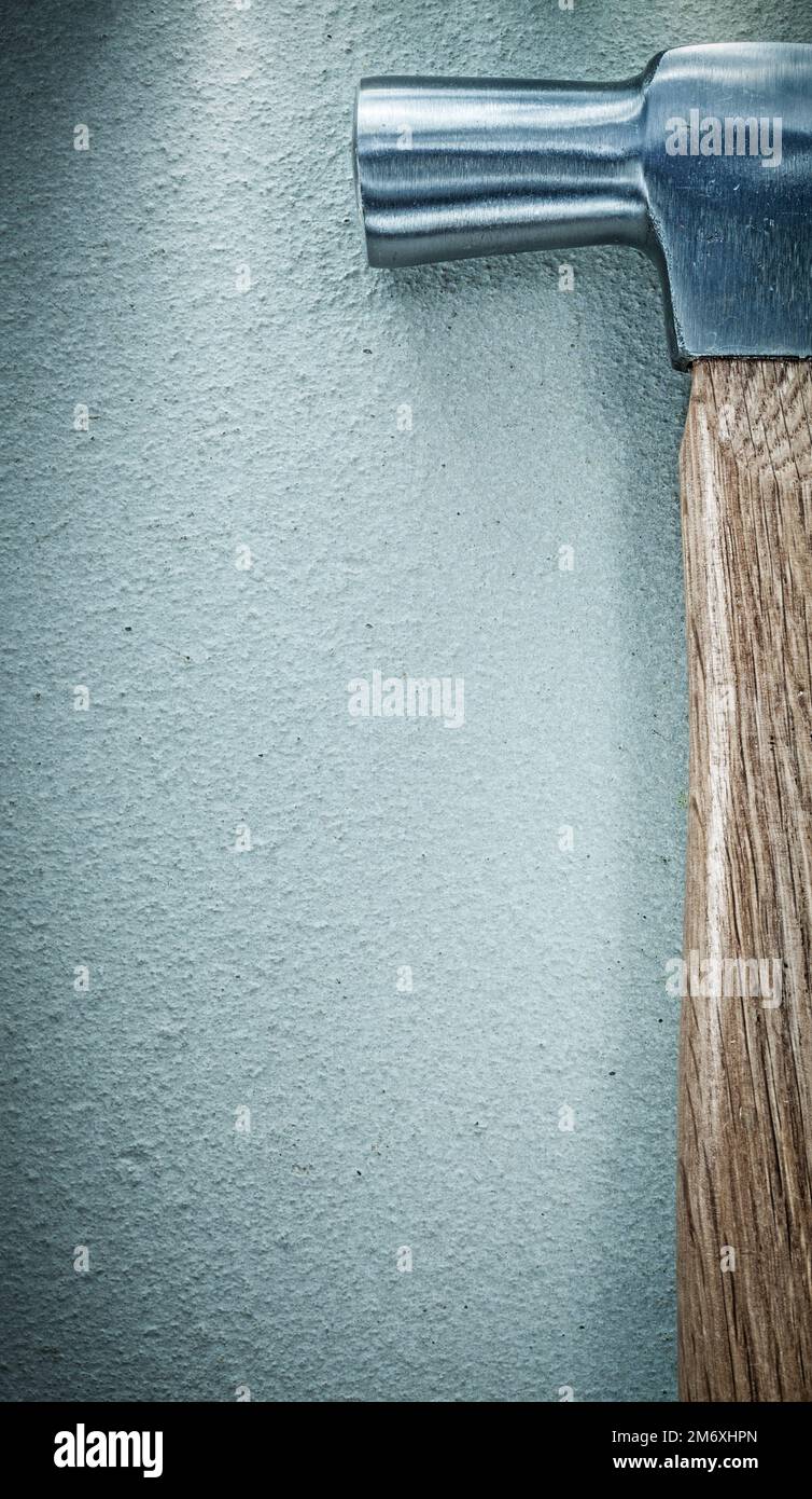 Construction claw hammer on concrete background Stock Photo - Alamy