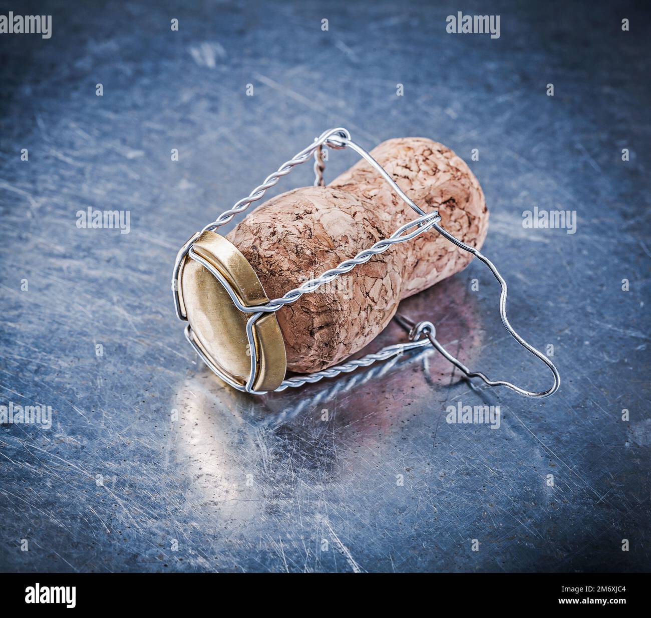 Cork tap with twisted wire on metallic background Stock Photo - Alamy