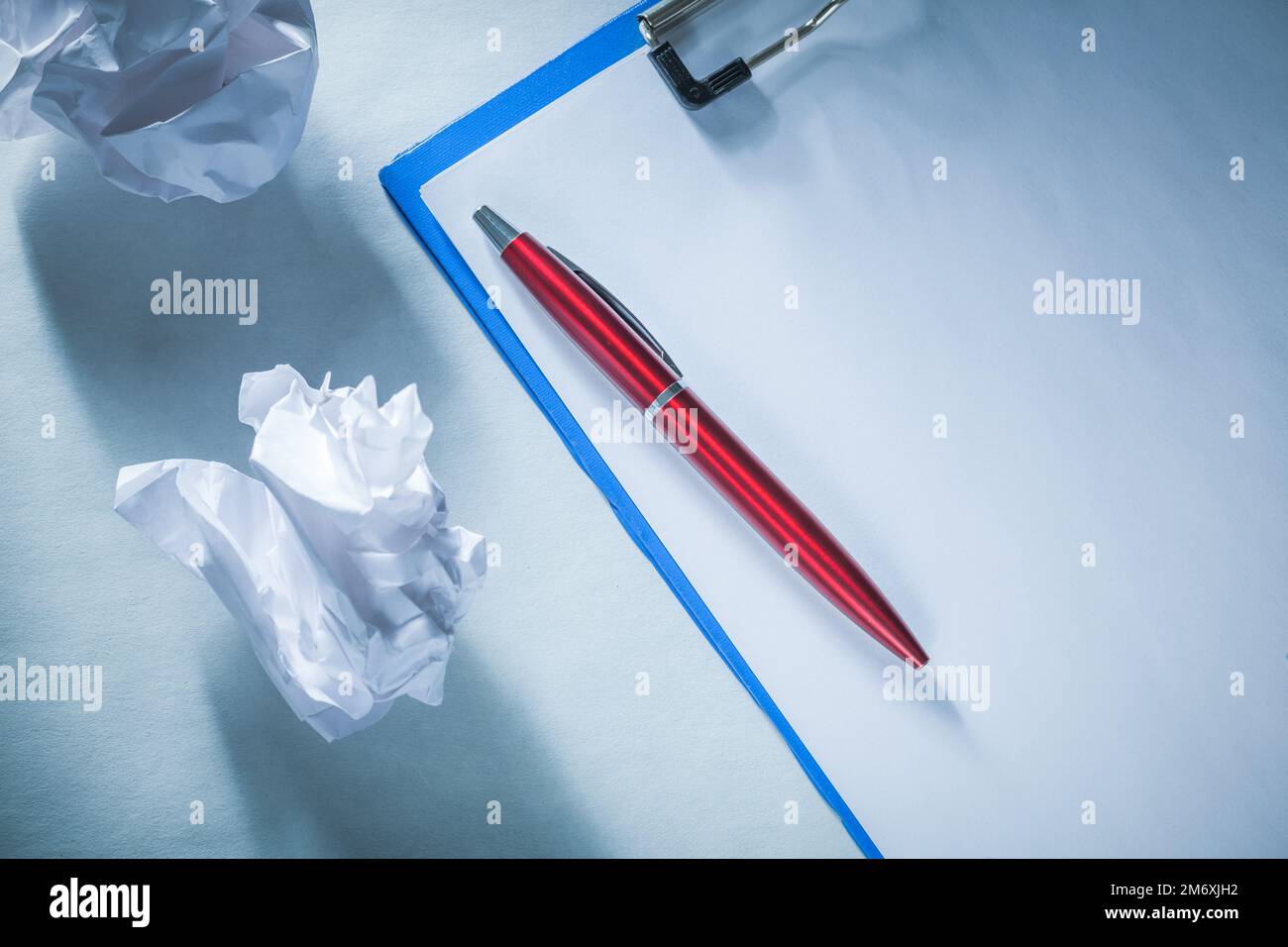 Crumpled paper balls biro pen clipboard Stock Photo - Alamy