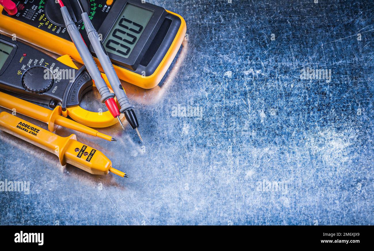 Digital amperemeter electric tester multimeter on metallic background ...