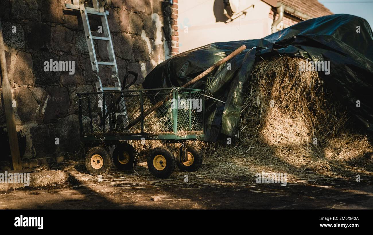 The rural equipment at the harvested hay Stock Photo - Alamy