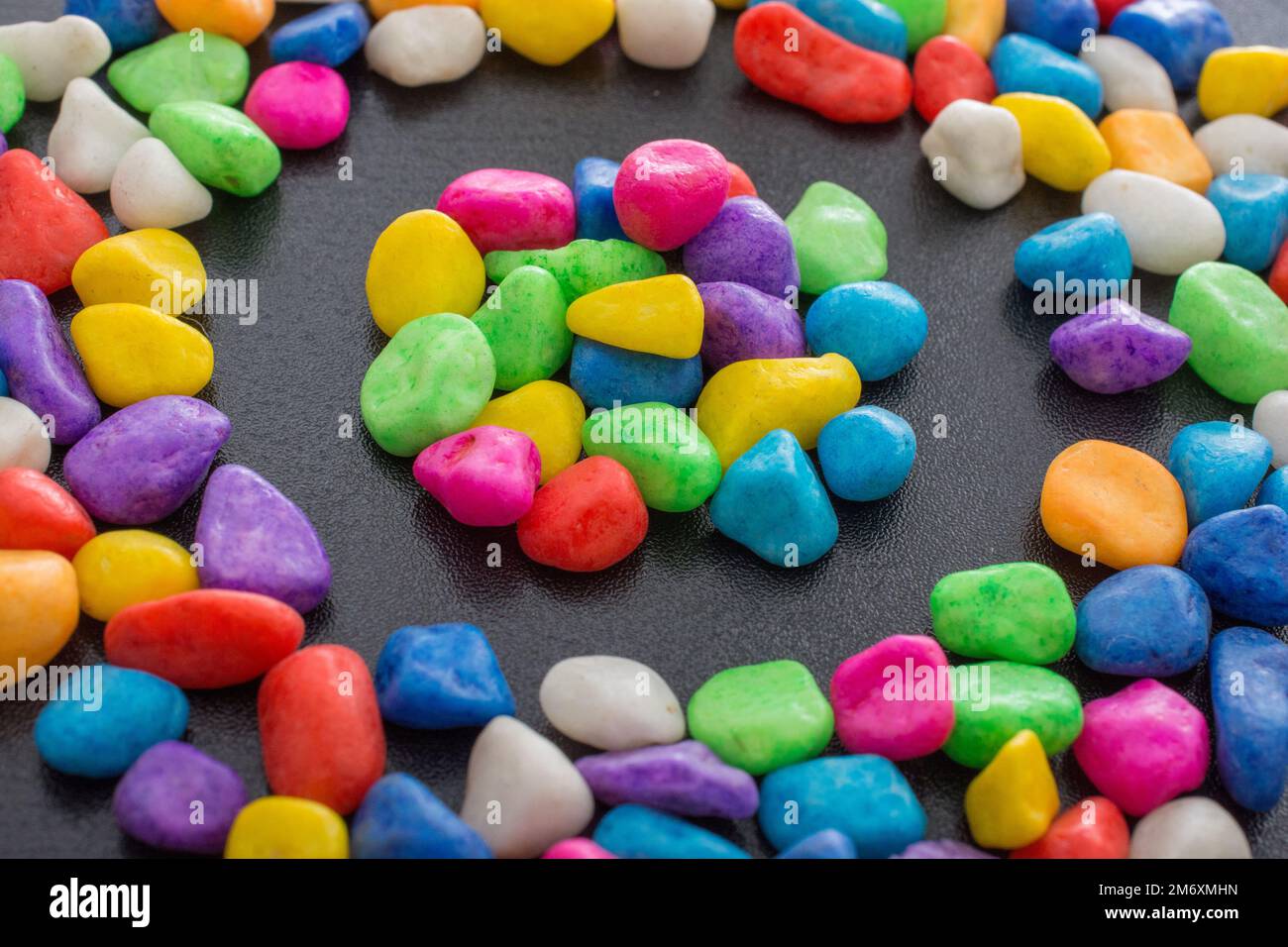 Pile of colorful pebbles as a stone background Stock Photo - Alamy