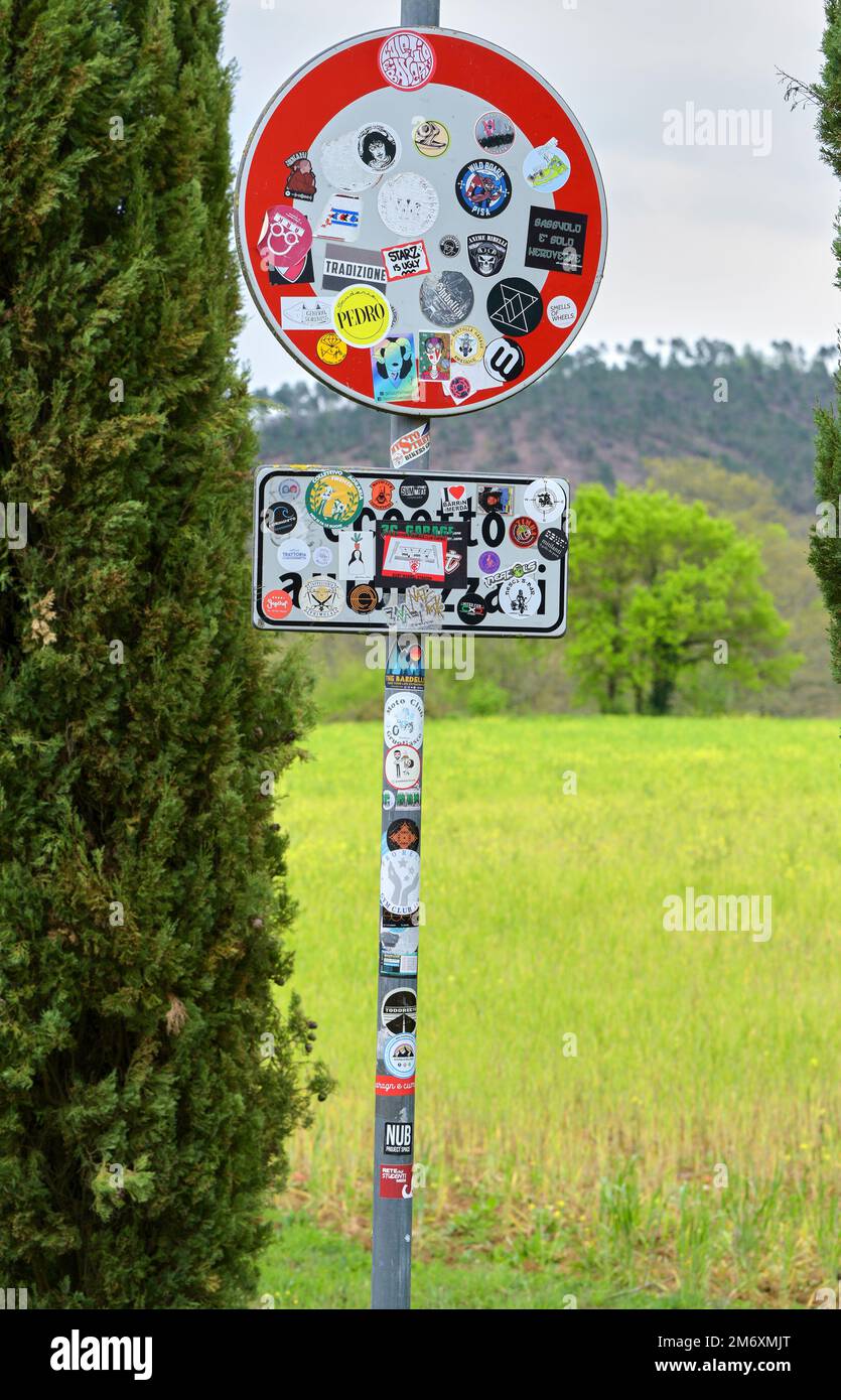 Road sign full with stickers in the countryside Stock Photo - Alamy