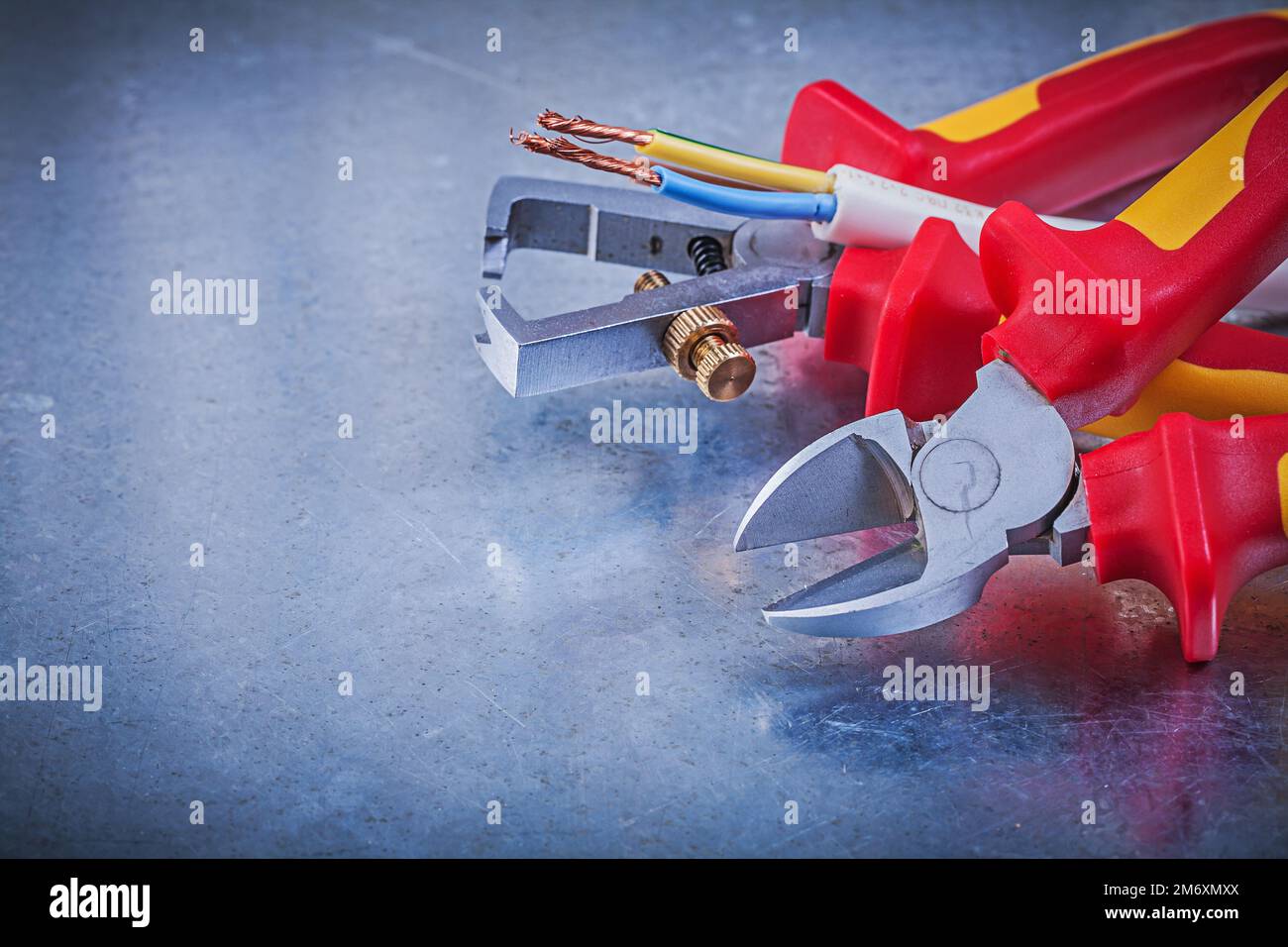 Insulated strippers nippers electrical wires on metallic background ...