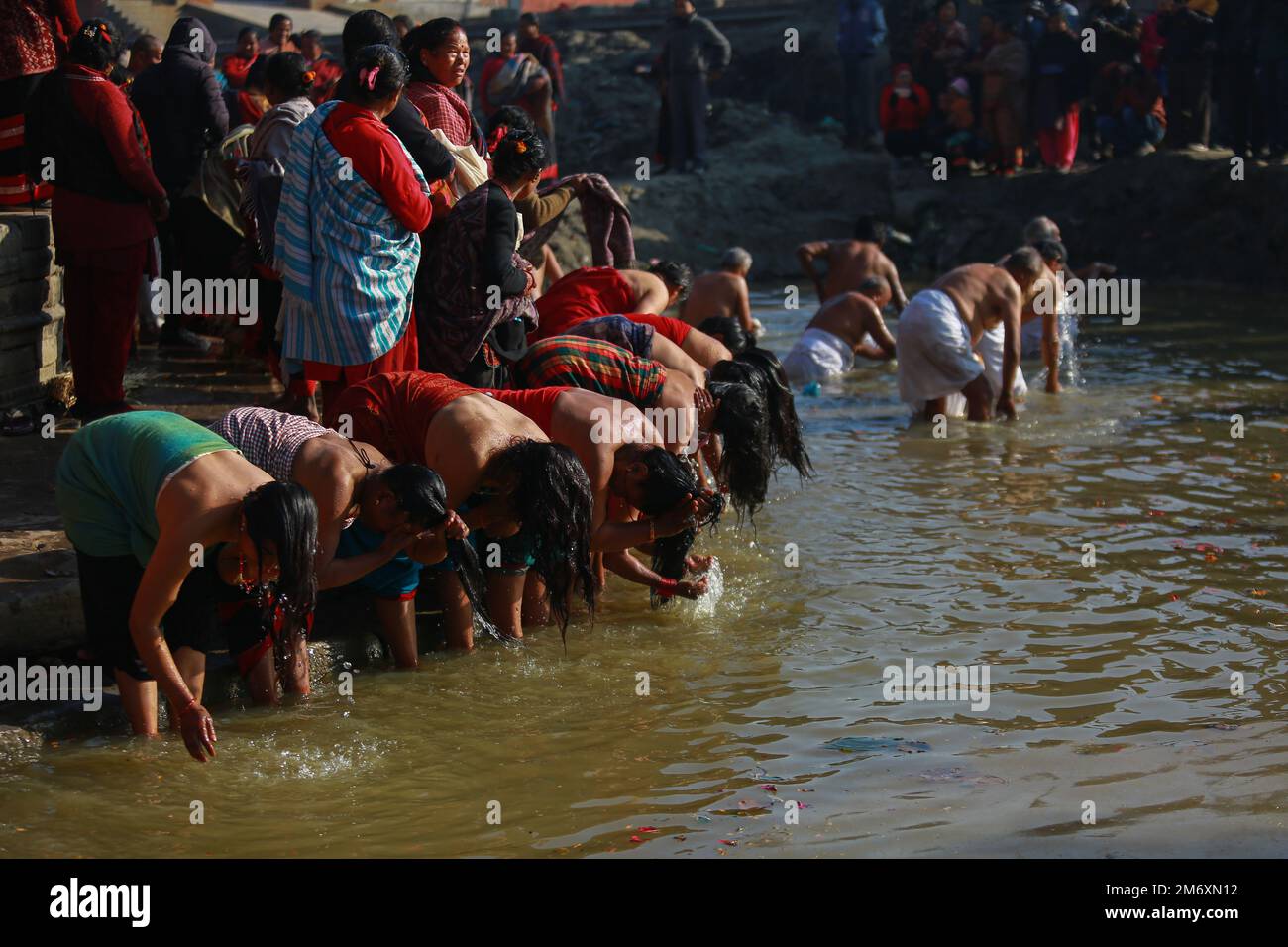 Nepal. 6th Jan, 2023. Devotees takes an holy bath at the bank of ...