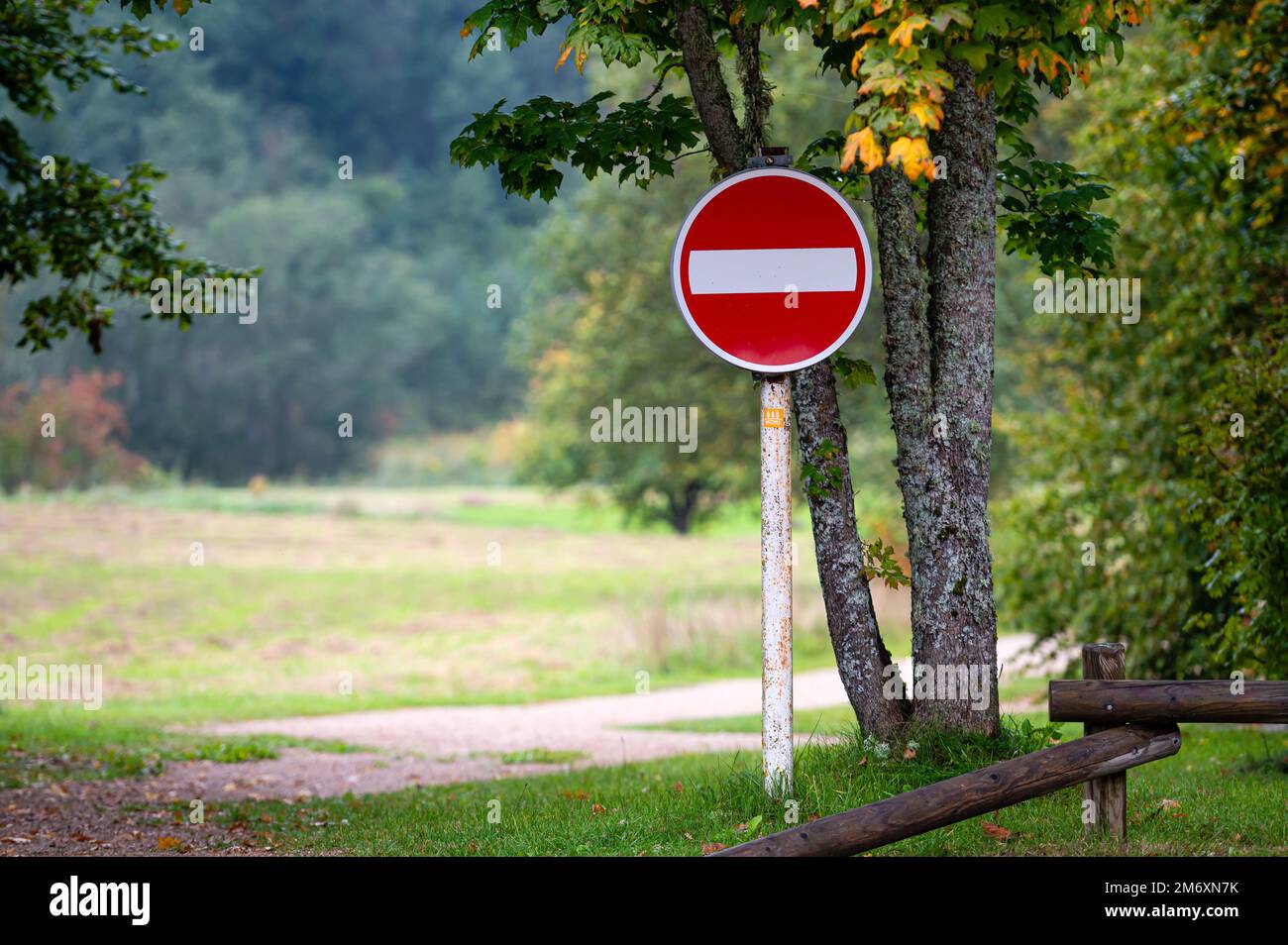 Red road sign "Entry prohibited" at the entrance to private territory ...