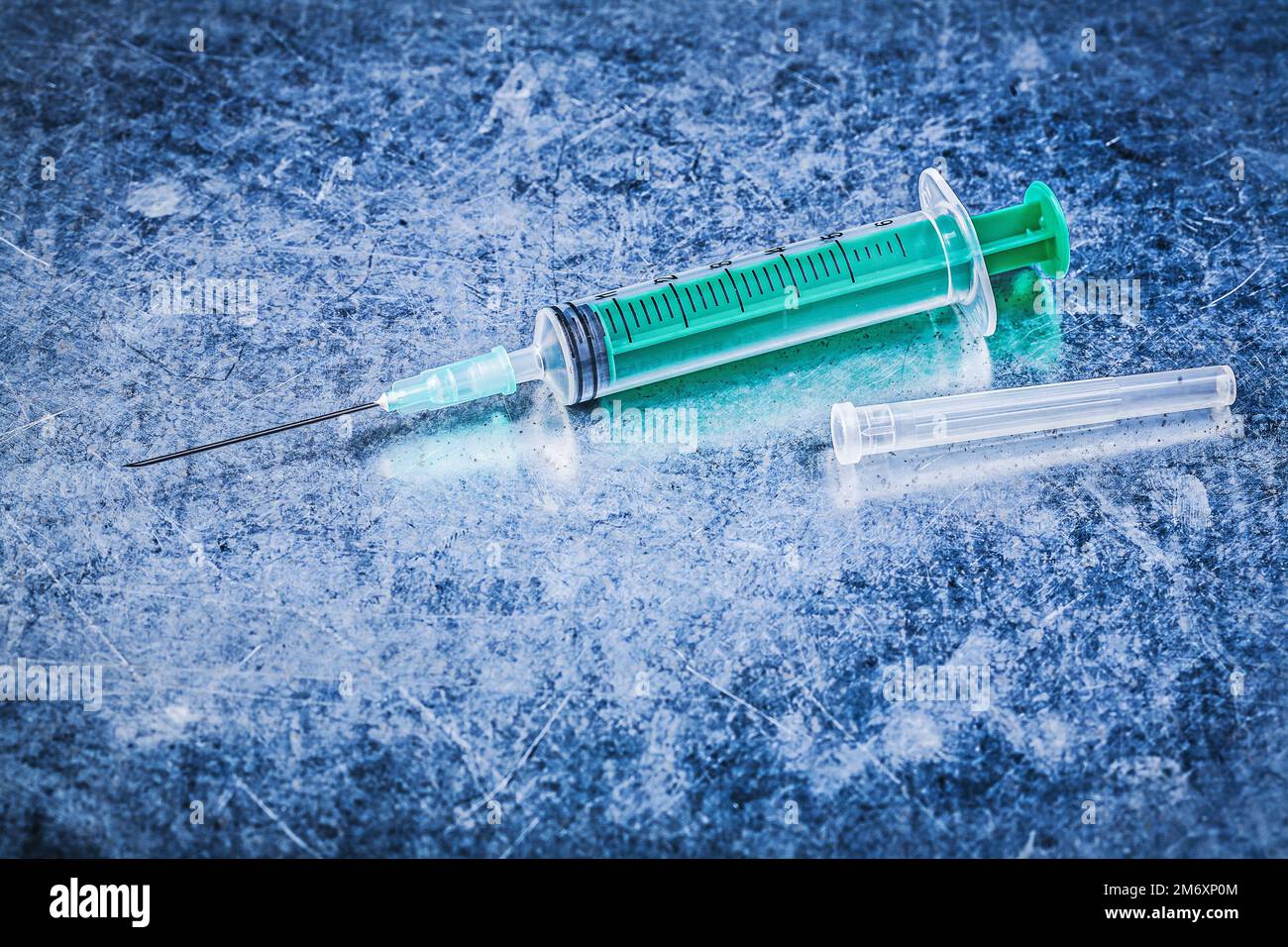 Medical injector surgical needle on metallic background medicine ...