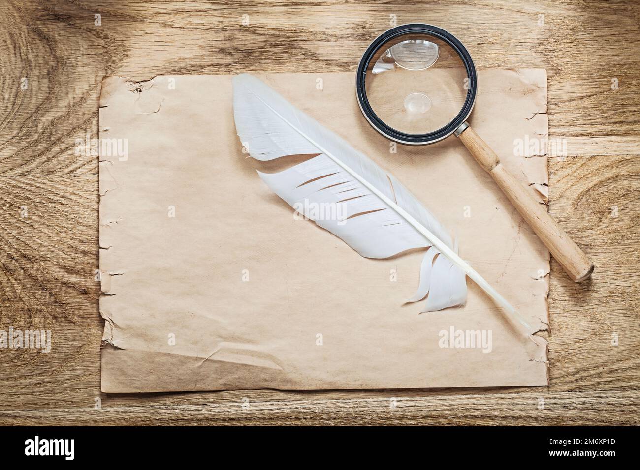 Medieval parchment magnifier plume on wooden board Stock Photo - Alamy
