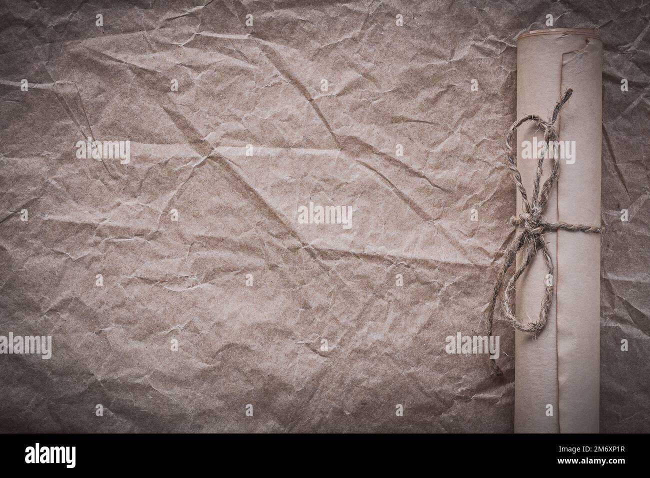 Medieval paper scroll on crumpled wrapping sheet Stock Photo - Alamy