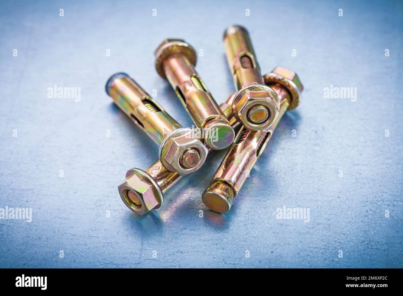 Metal anchor bolts for concrete walls on metallic background repairing ...