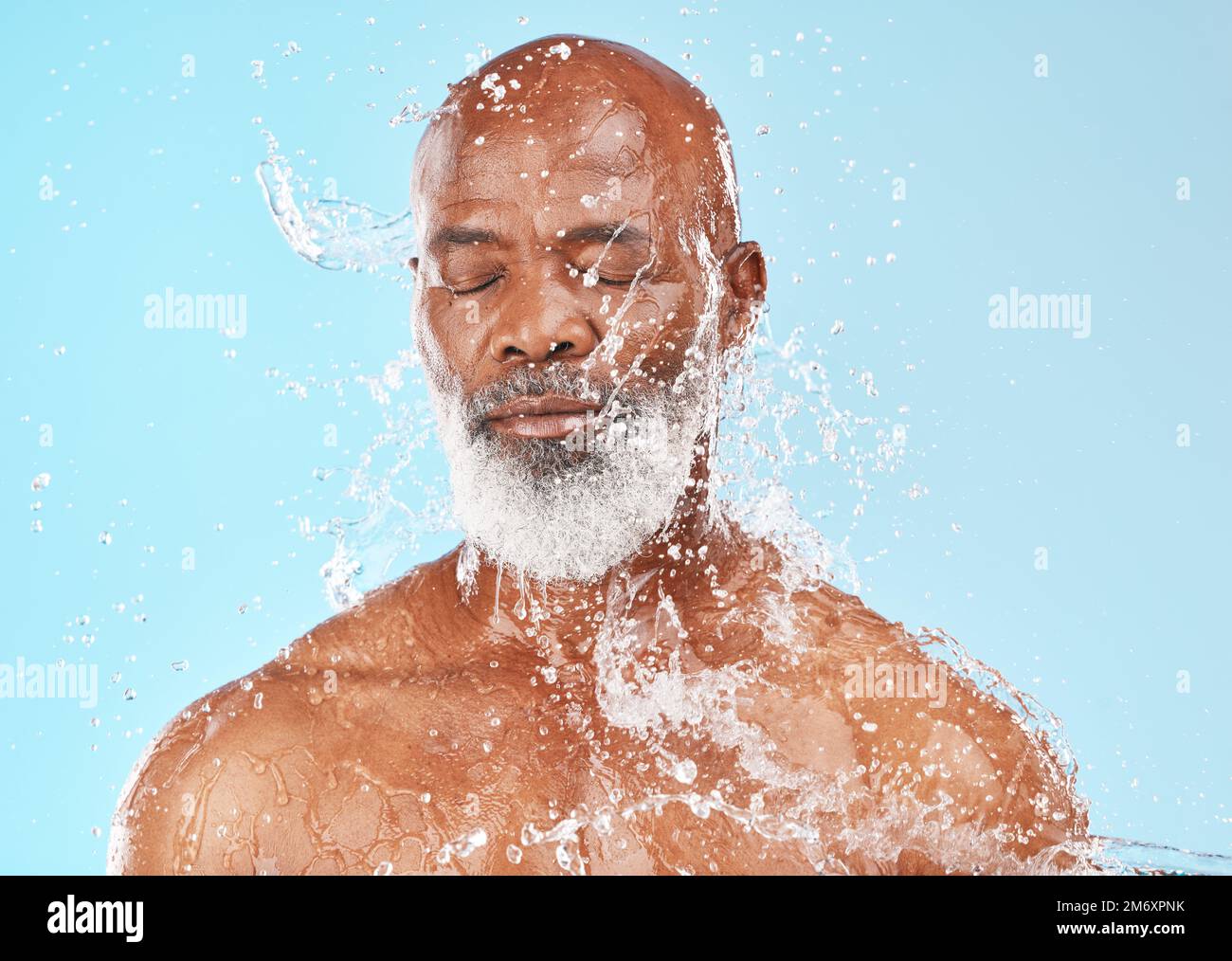 Senior black man, water splash and skincare in studio for wellness ...