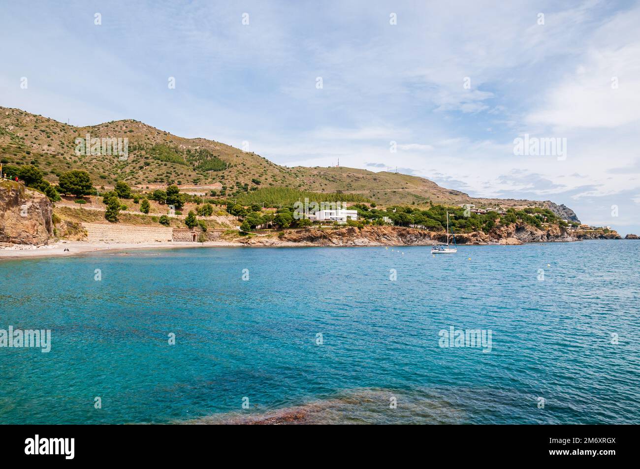 panoramic view of the coast near the city of Colera, with a sailing ...