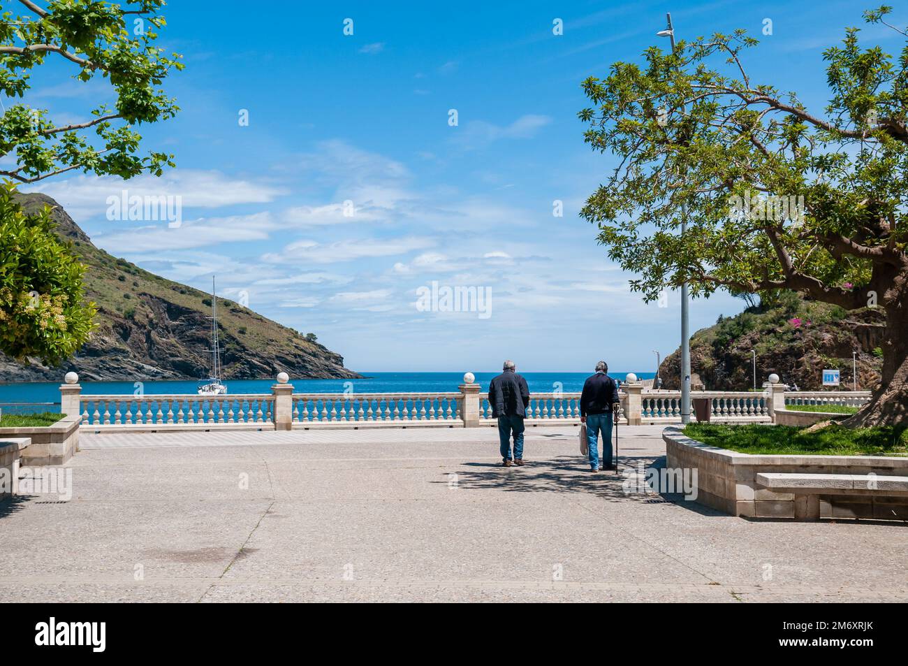 two elderly men walking on the seafront, Portbou, Alt Empordà ...