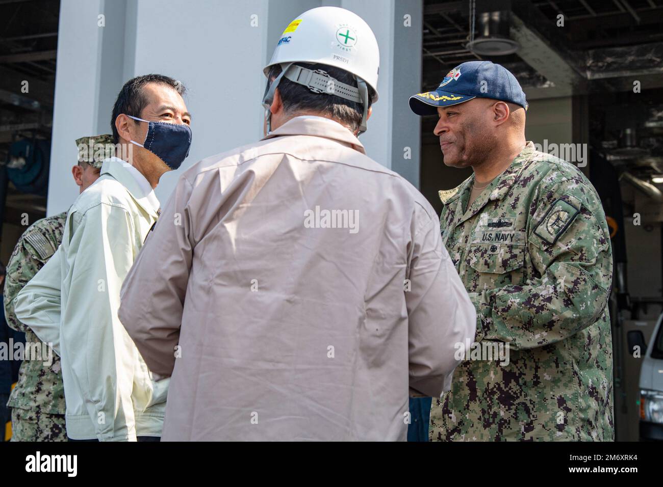 Capt. David Adams, Commander, Fleet Activities Sasebo (CFAS), speaks to ...