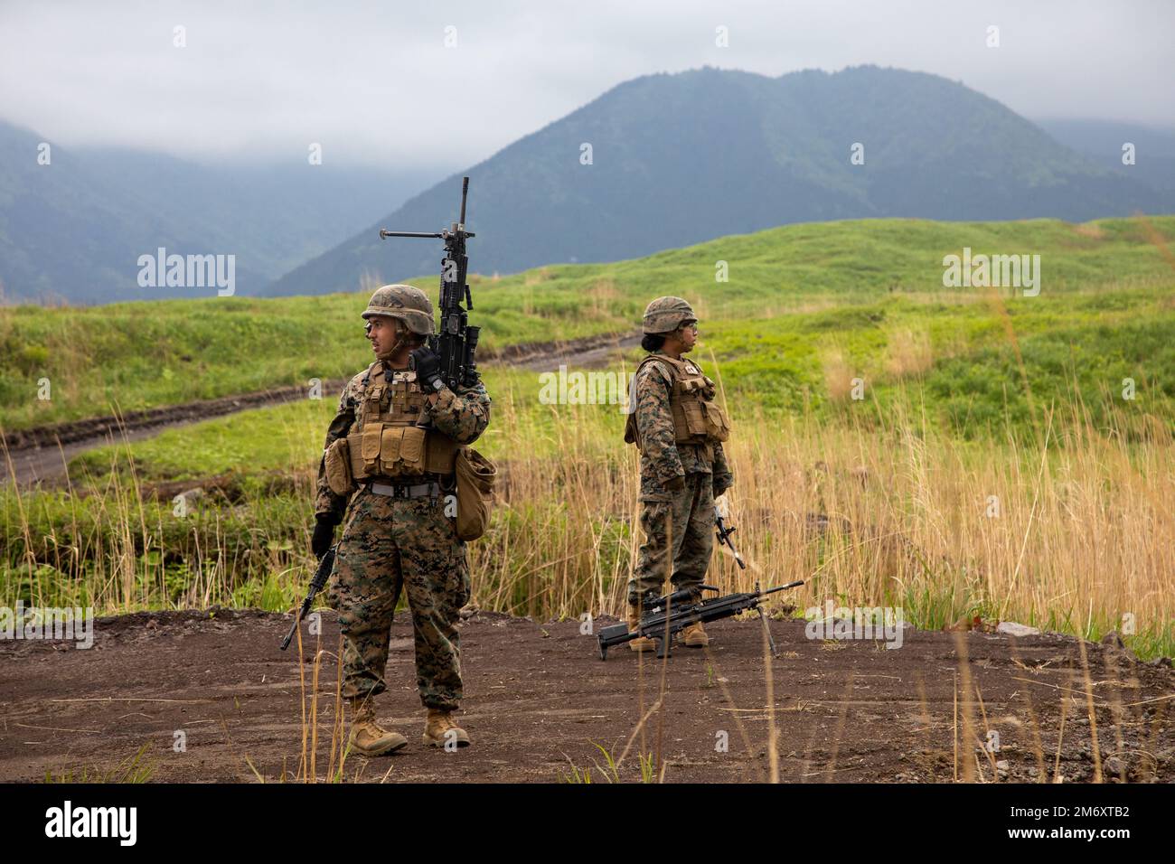 U.S. Marine Corps Cpl. Kevin Cadiente (left) and Cpl. Kristine ...