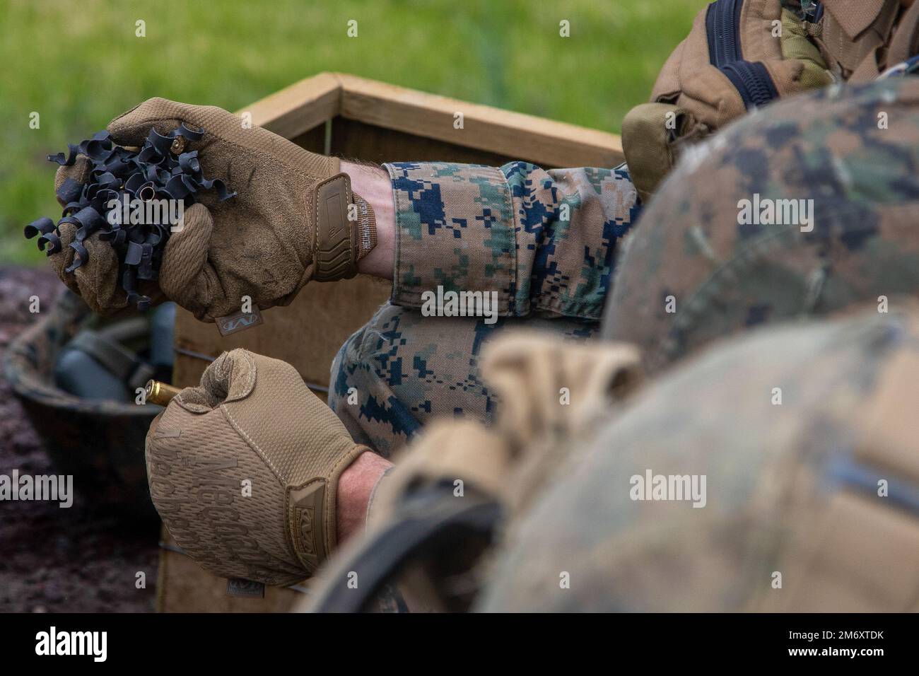 A U.S. Marine with Marine Wing Support Squadron (MWSS) 171 cleans up ...