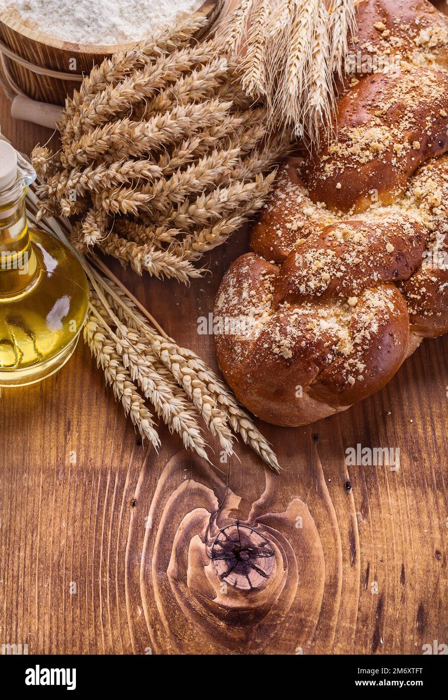 composition bread bottle oil wheat ears flour in bucket on vintage ...