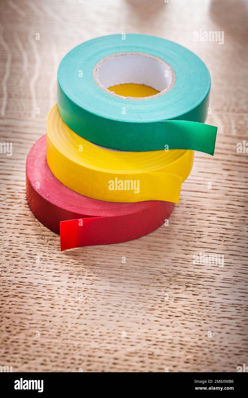 green red yellow rolls of insulating tape construction concept Stock ...