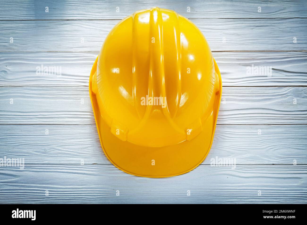 Hard hat on white board Stock Photo - Alamy