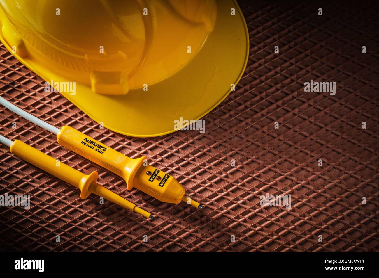 Hard hat electric tester on dielectric rubber mat Stock Photo - Alamy