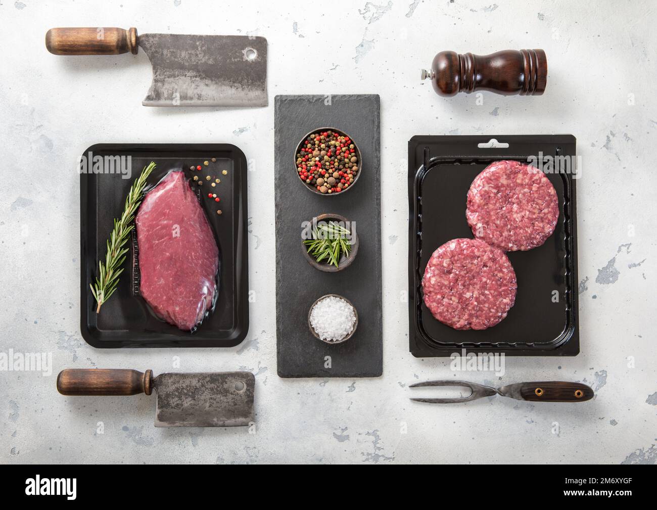 Raw fresh beef sirloin fillet steak and mince burgers sealed in vacuum ...