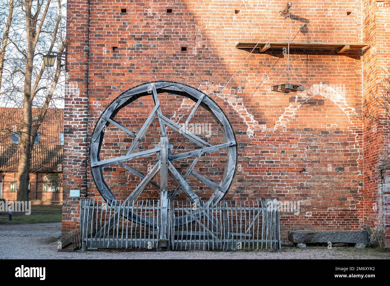 Historic treadwheel crane with pulley, plank scaffold and a hanging ...