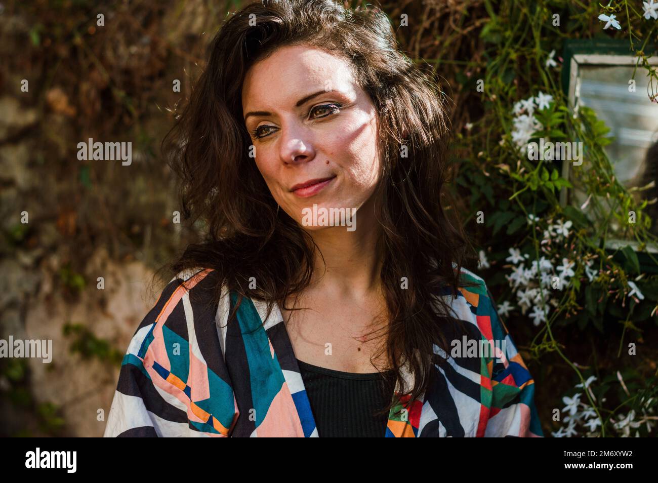 portrait of caucasian woman of french ethnicity outdoors on the terrace ...