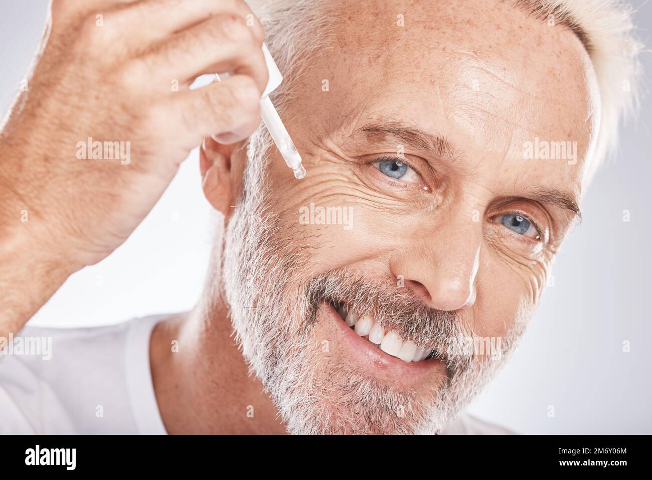 Skincare, cosmetics and senior man with oil for face glow, beauty and ...