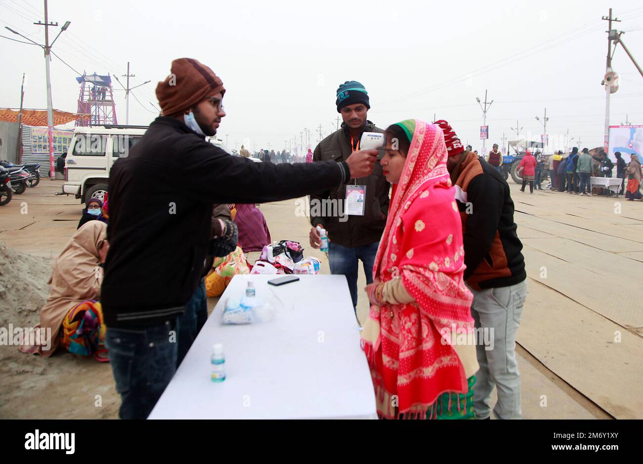 Prayagraj, India. 06/01/2023, A health valunteer check temperature of ...