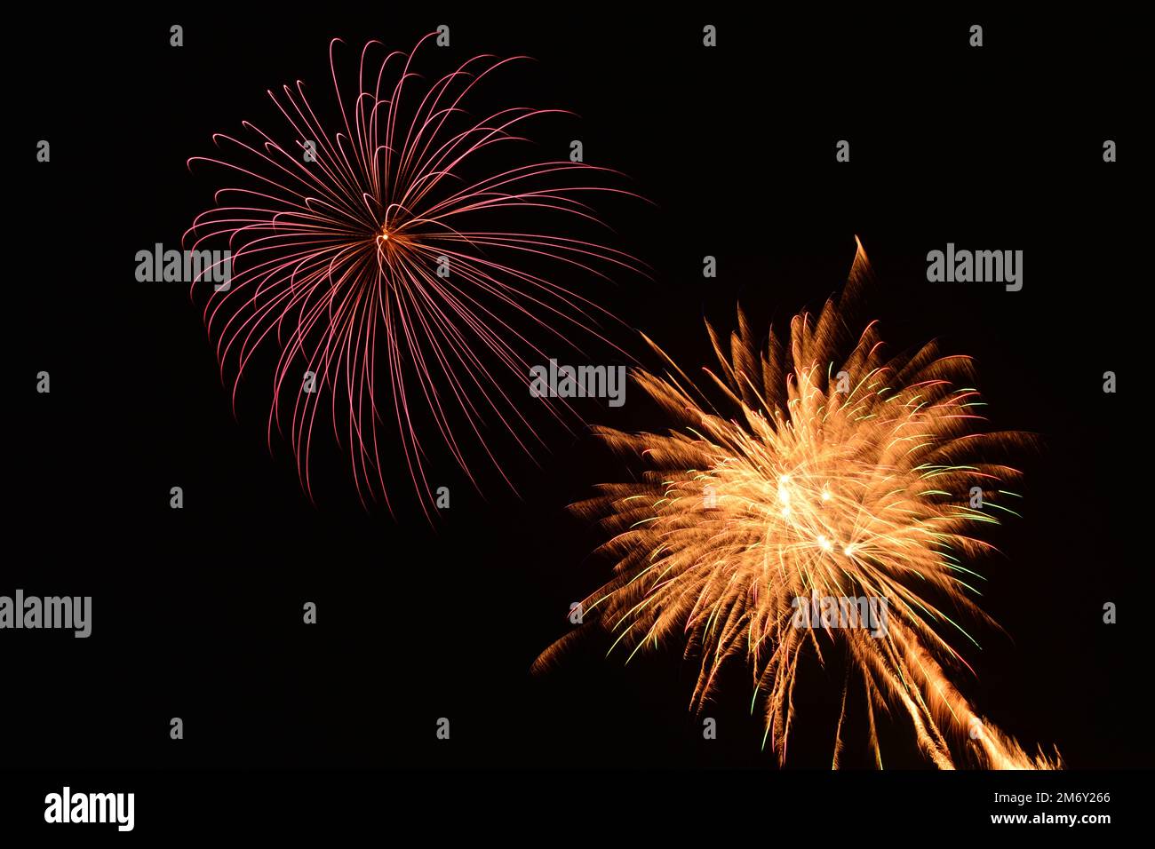 A beautiful shot of exploding colorful fireworks in a black night sky ...