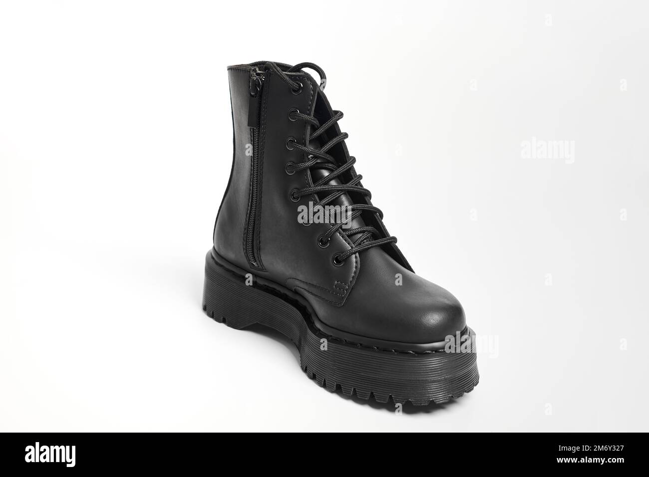 One black women combat boot on high heel platform with lug sole on ...