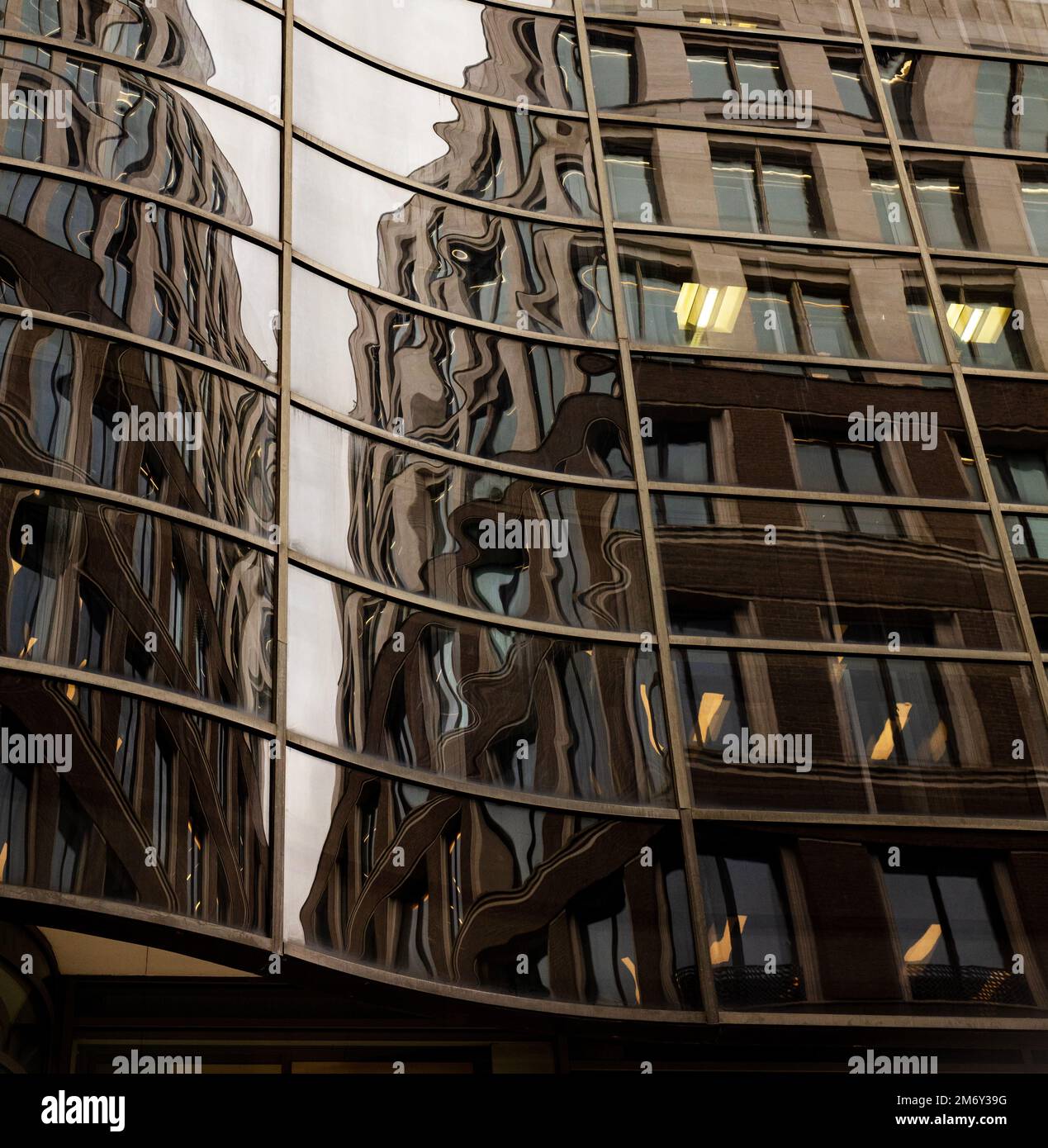 Reflections in glass wall of high-rise building in Mayfair, London ...