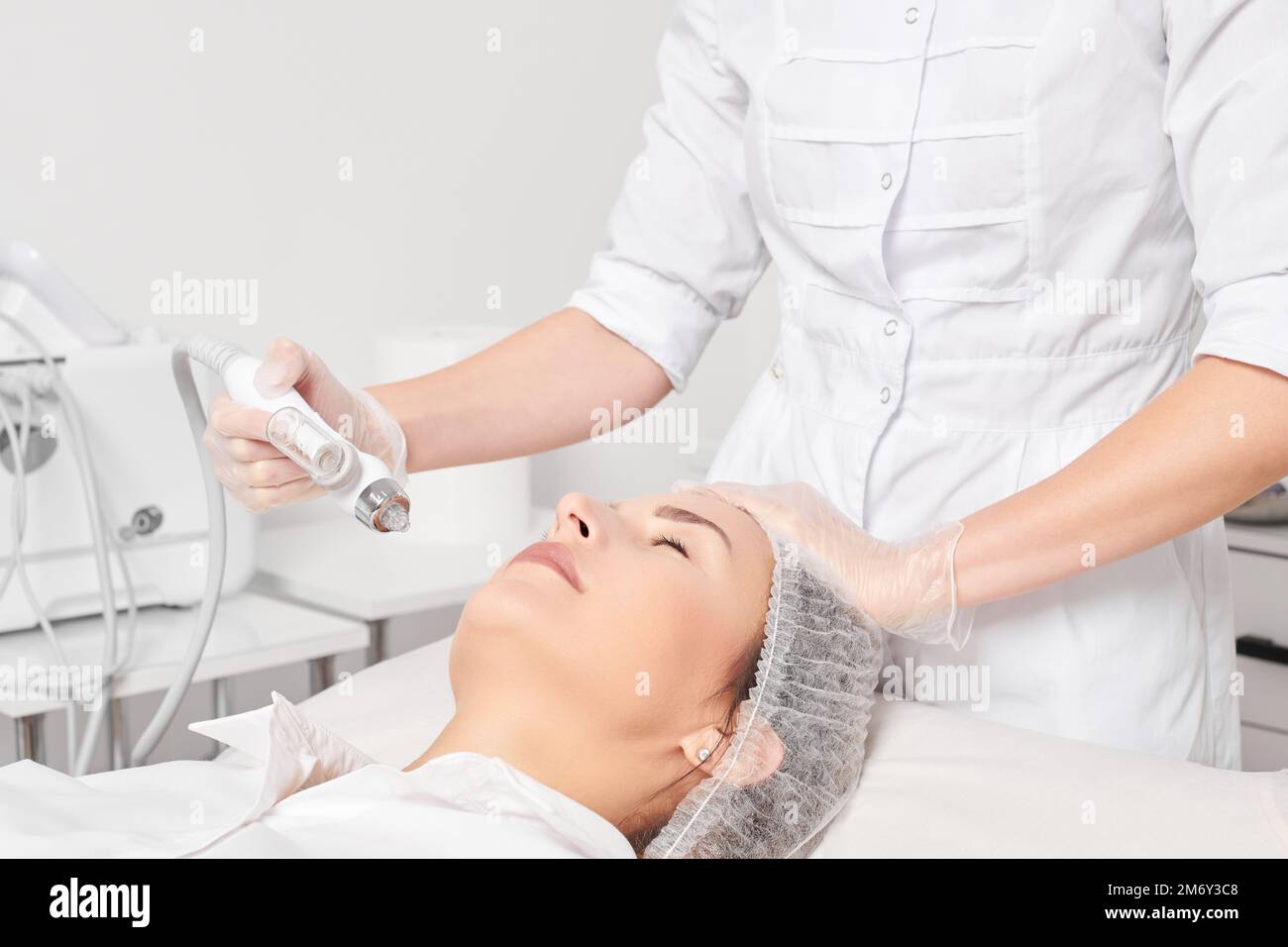 Cosmetologist makes facial gas liquid oxygen serum epidermal peeling ...