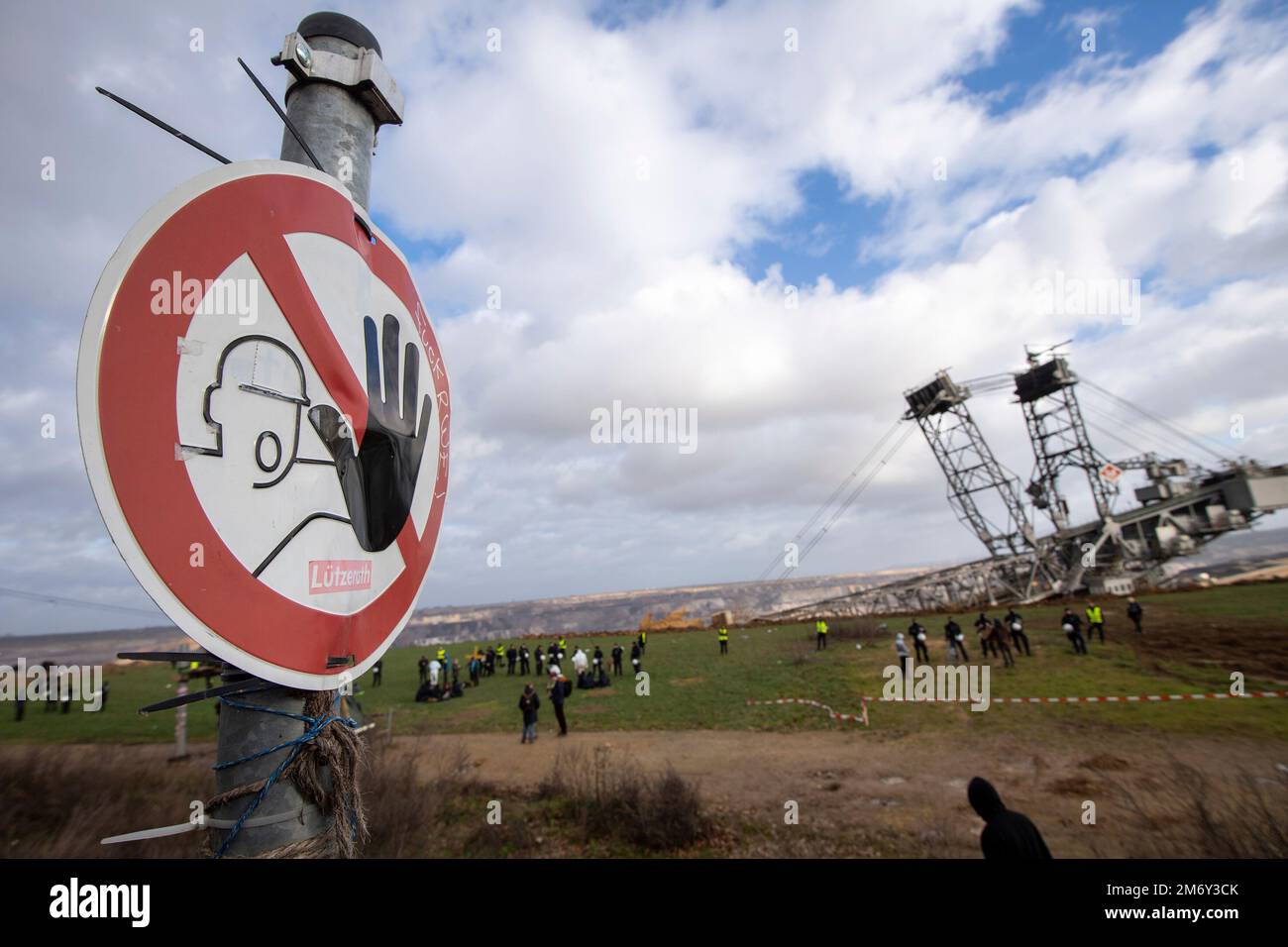 Warning sign, in the background the Garzweiler opencast mine, a bucket ...