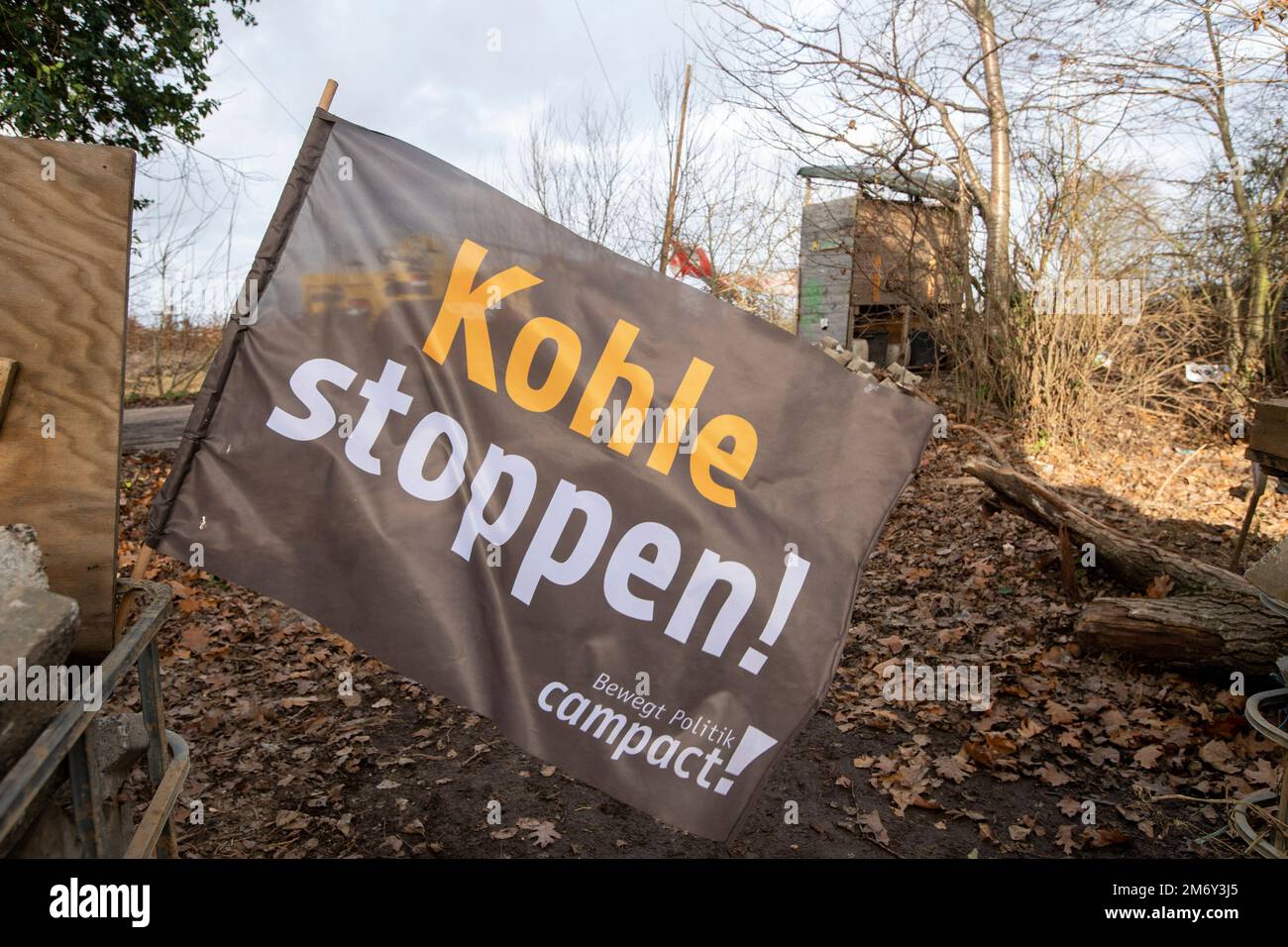 STOP COAL flag in the protest camp of the activists with tents, huts ...