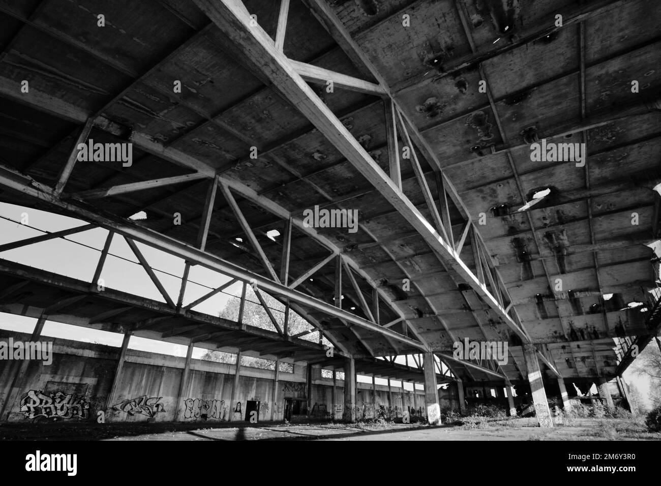 Old arched metal structures abandoned air hangar Stock Photo - Alamy