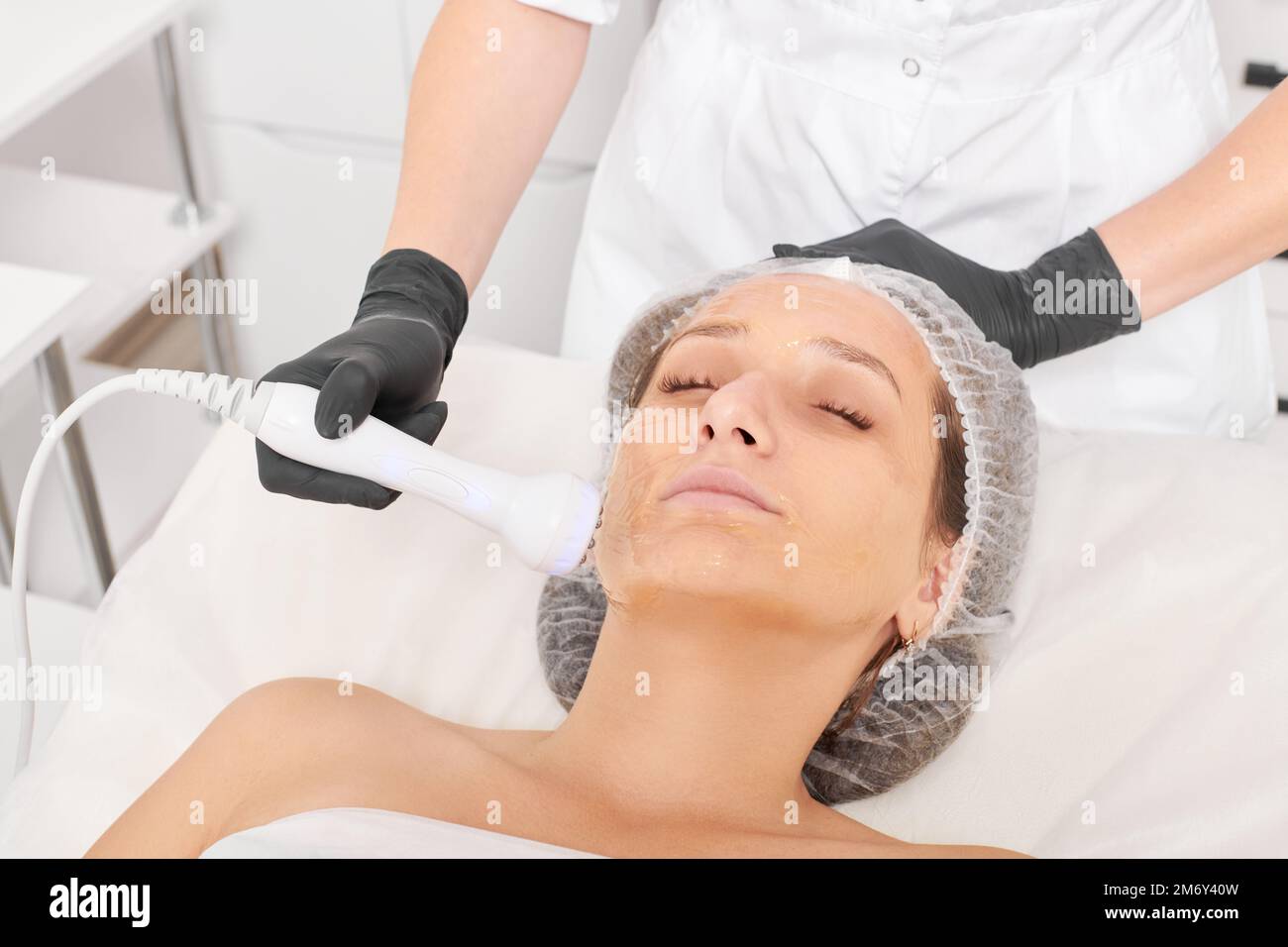 Cosmetologist makes RF lifting for rejuvenation woman face, anti aging ...