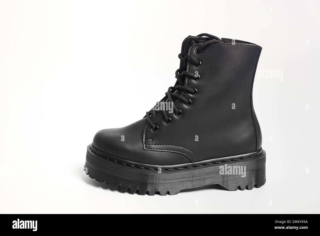 One black women combat boot on high heel platform with lug sole on ...