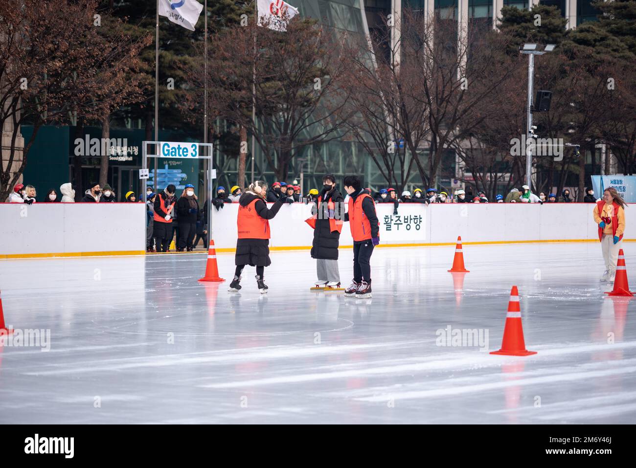 People ice skating on the temporary ice skating ring in front of the ...