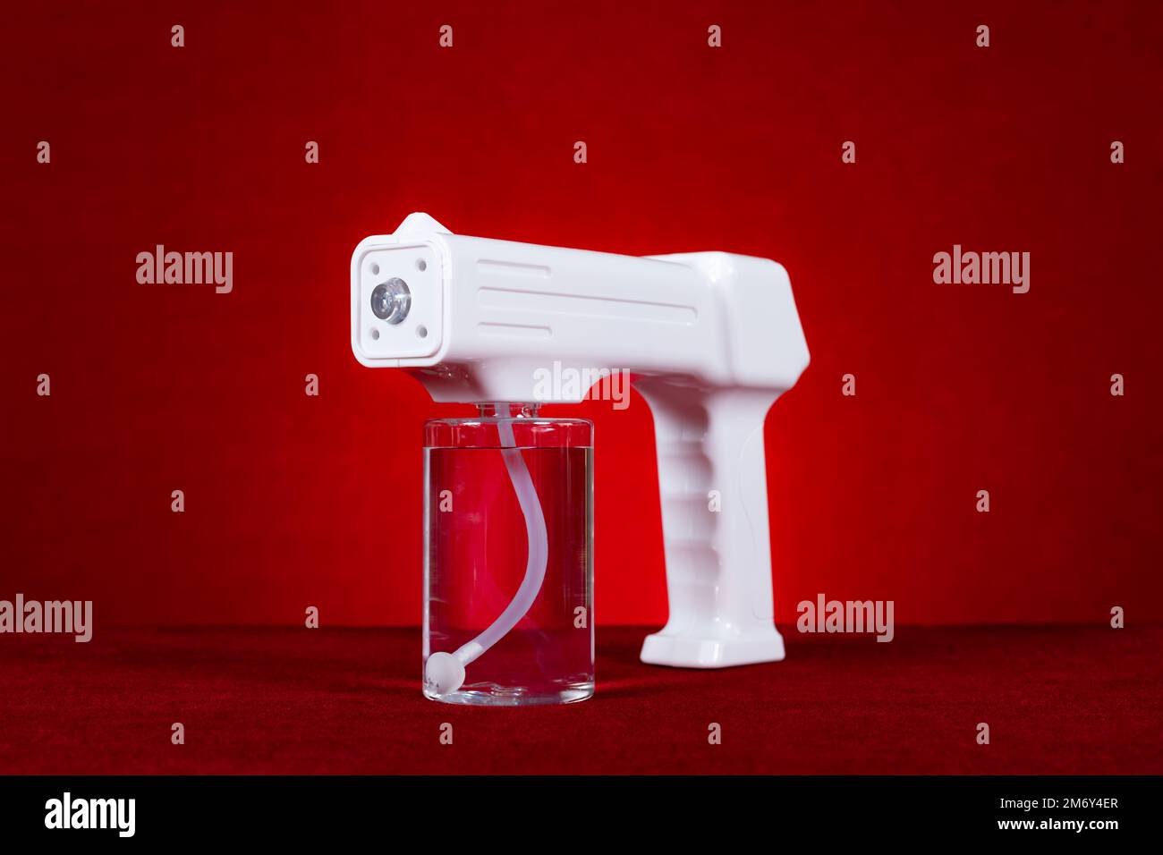 rechargeable electric gun with disinfectant liquid Stock Photo - Alamy