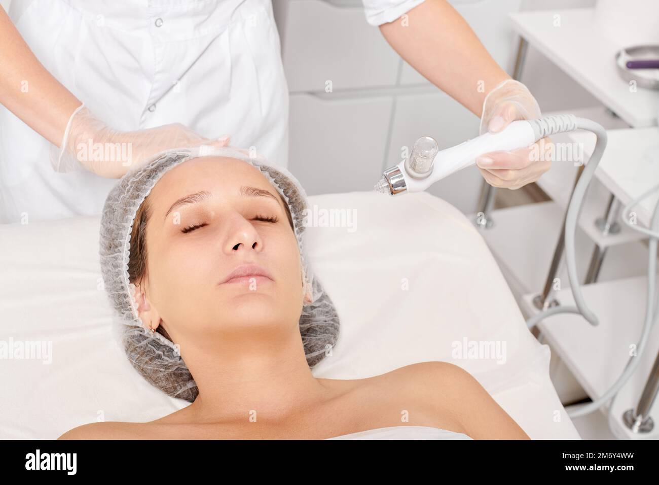 Beautician makes facial gas liquid oxygen serum epidermal peeling for ...