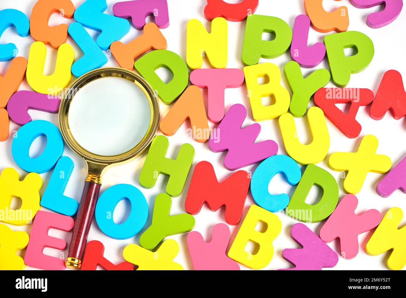 Magnifying glass and bright multicolored letters English alphabet Stock ...