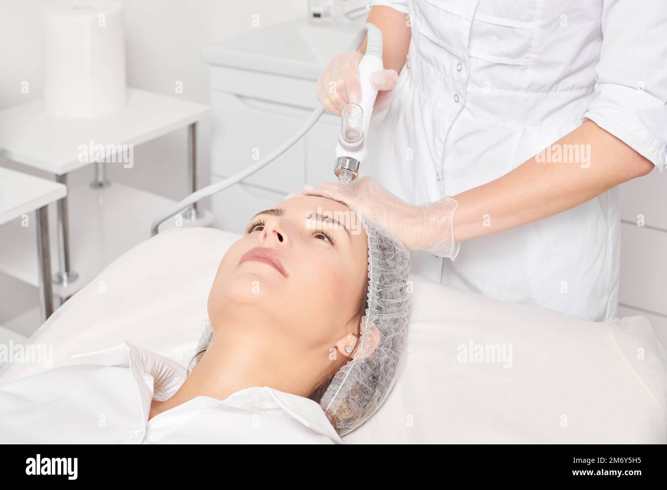Beautician makes facial gas liquid oxygen serum epidermal peeling for ...