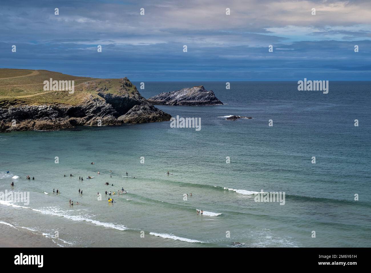 Holidaymakers in the sea at Polly Porth Joke on the coast at Newquay in ...