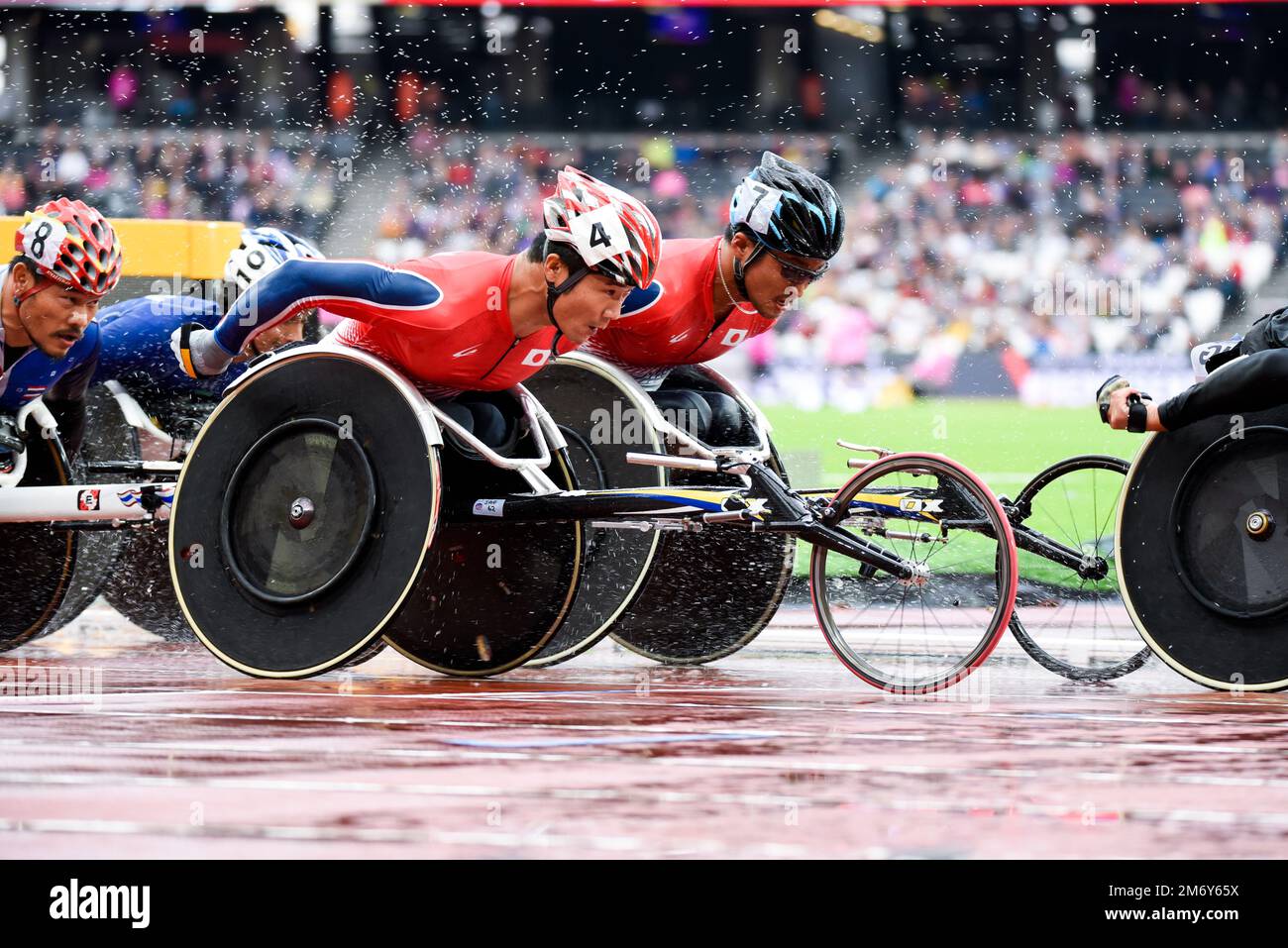 Masayuki Higuchi wheelchair athlete competing in wet 5000m T54 final at ...