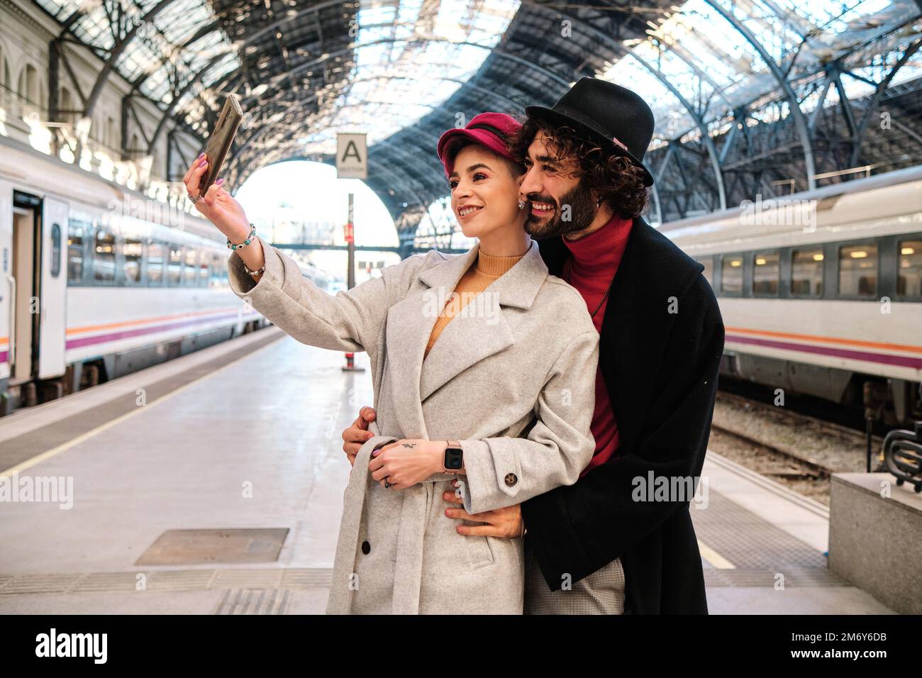 Couple embrace train station in hi-res stock photography and images - Alamy