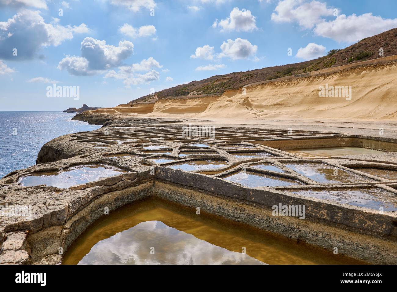 Xwejni salt pans along the coast in Gozo, Salina Bay, Malta Stock Photo ...