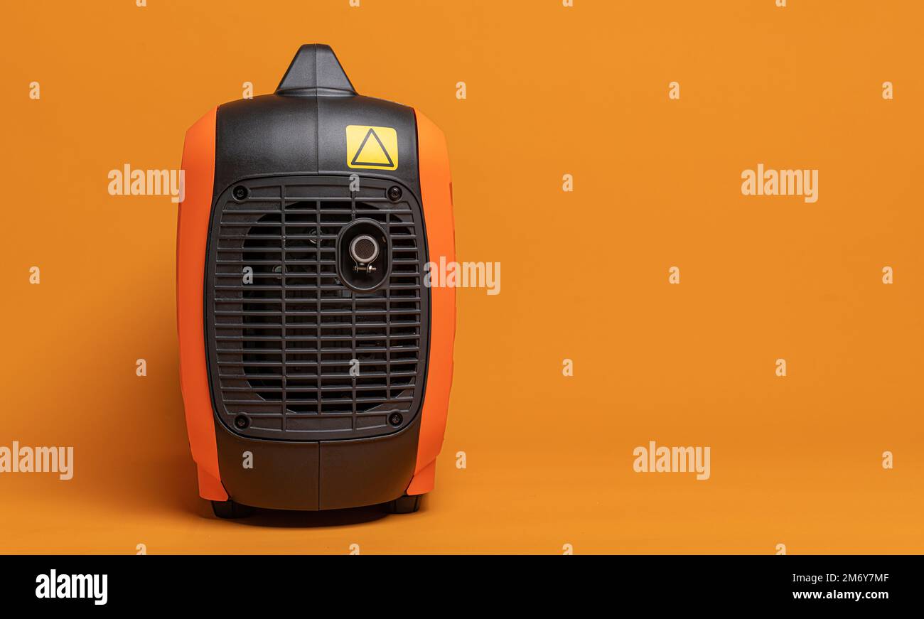 Inverter gasoline generator on an orange background Stock Photo - Alamy